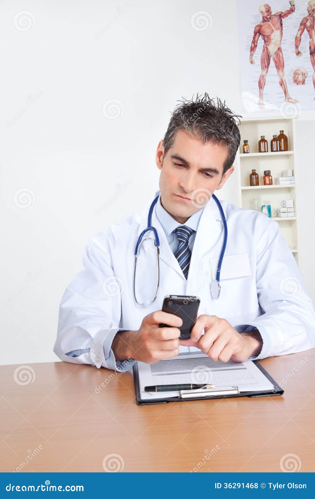 Male Doctor Using Mobile Phone Stock Photo - Image of desk, male: 36291468
