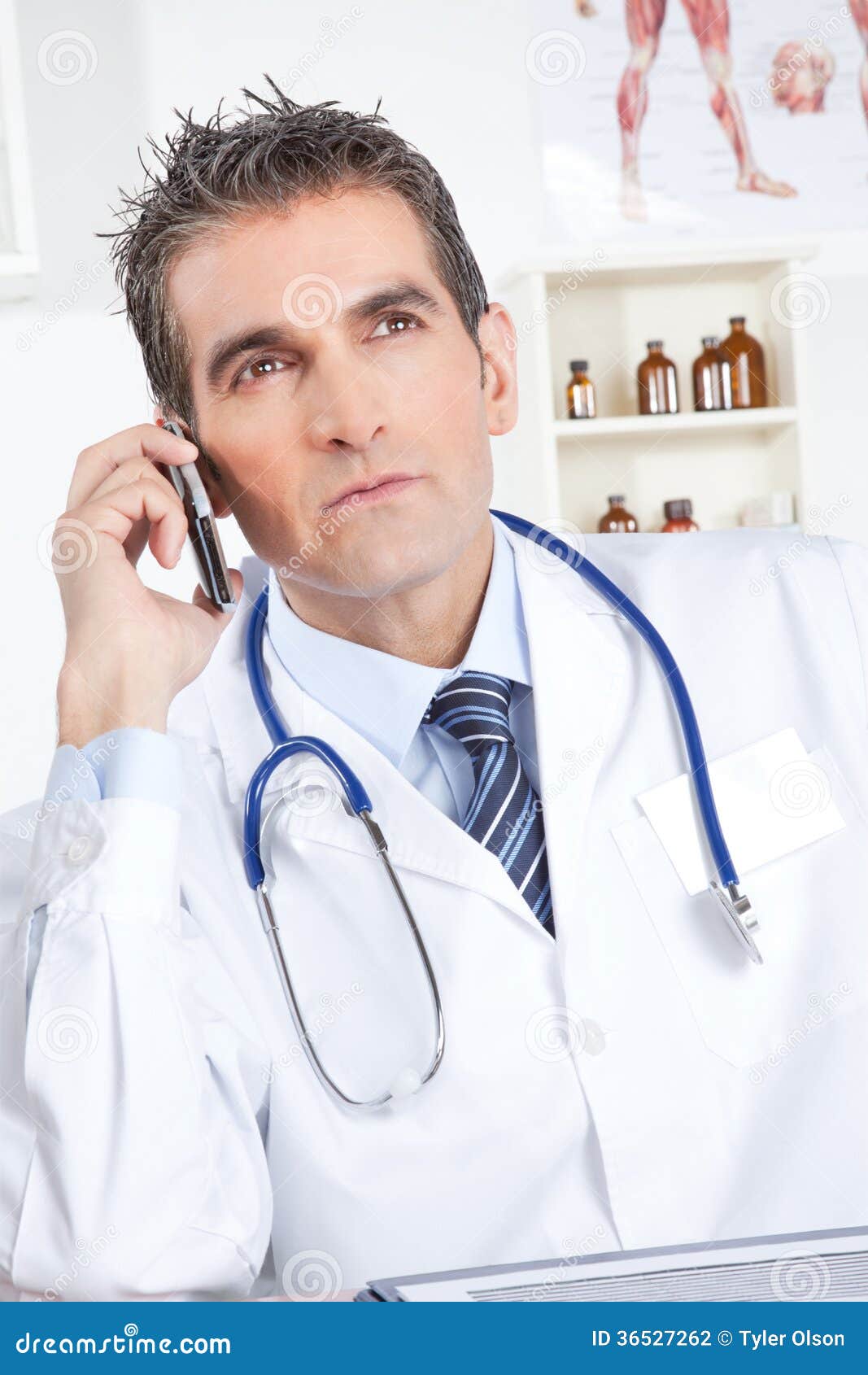 Male Doctor Using Mobile Phone Stock Photo - Image of medicine, mobile ...