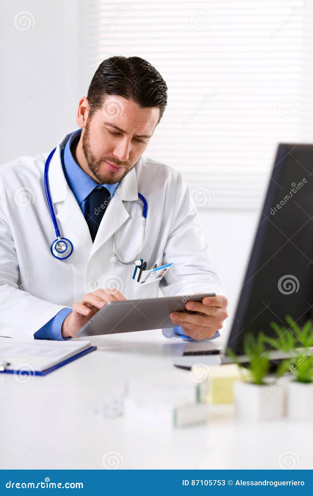 Male doctor using tablet stock image. Image of pharmacy - 87105753