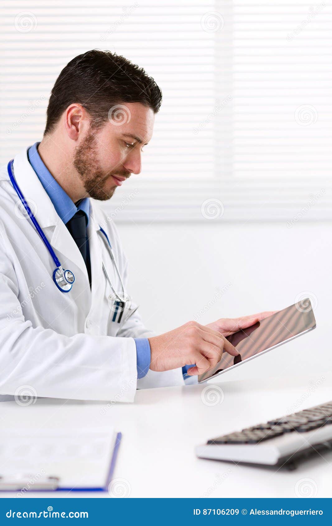Male doctor using tablet stock image. Image of packaging - 87106209