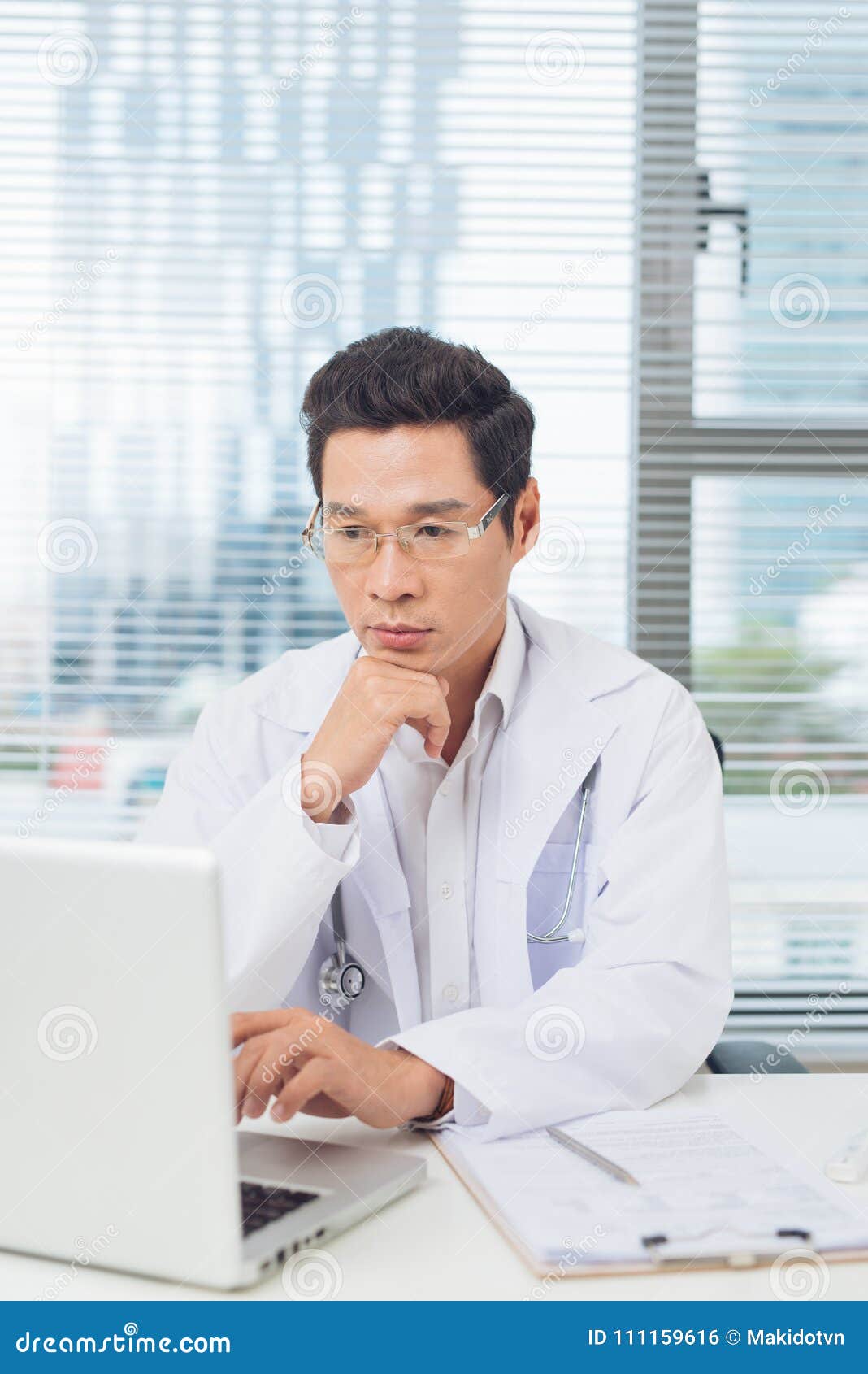 Male Doctor Working at Desk in Doctor`s Room Stock Photo - Image of ...