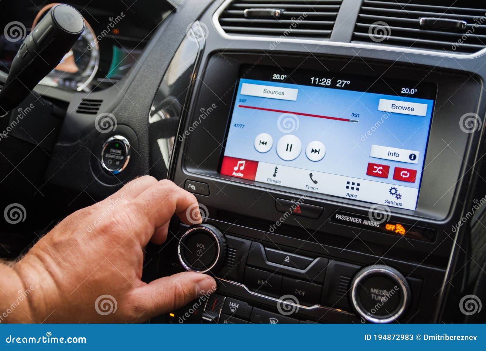 The Male Driver Controls the Settings of the Car Car Audio System Stock ...