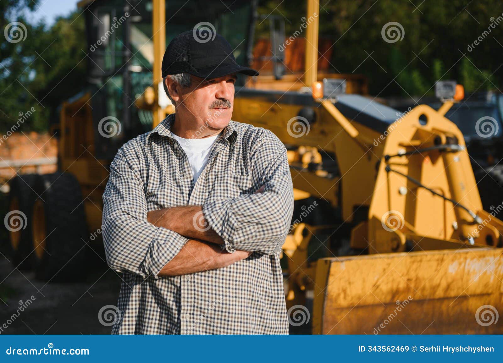 A Male Driver is Standing Next To a Grader Stock Image - Image of ...