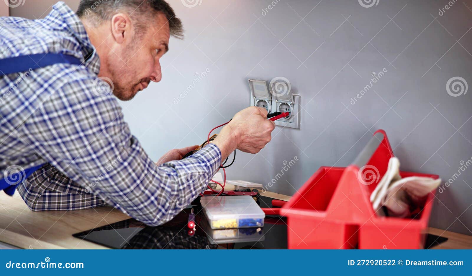 Male Electrician Checking Voltage of Socket with Multimeter Stock Photo ...