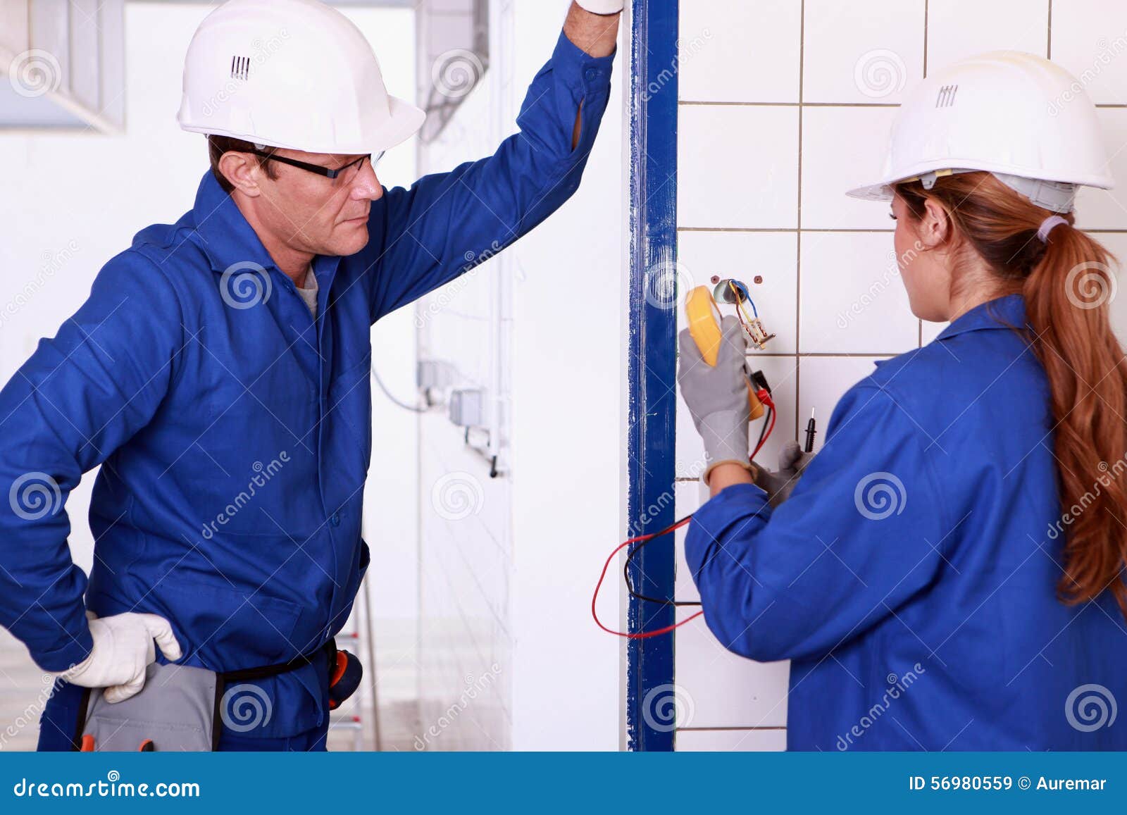 Male Electrician and Female Apprentice Stock Image - Image of safety ...