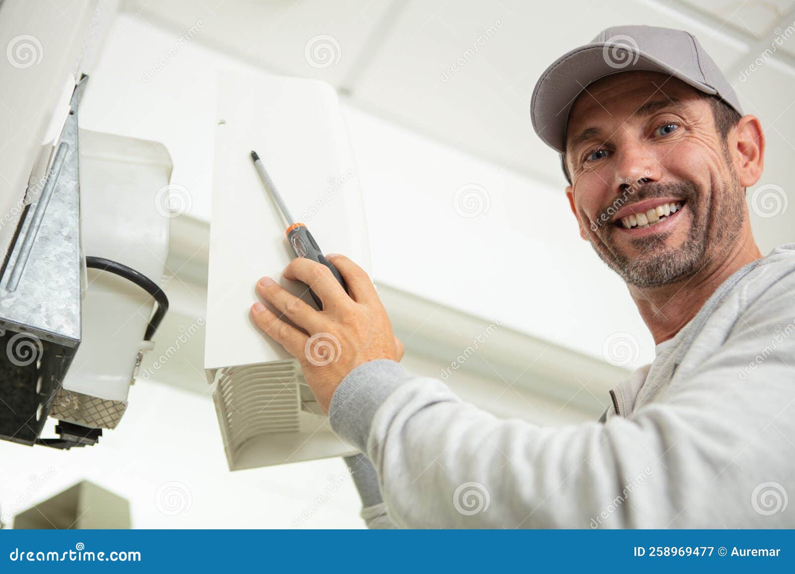 Male Electrician Installing Electrical Device on Wall Stock Image ...