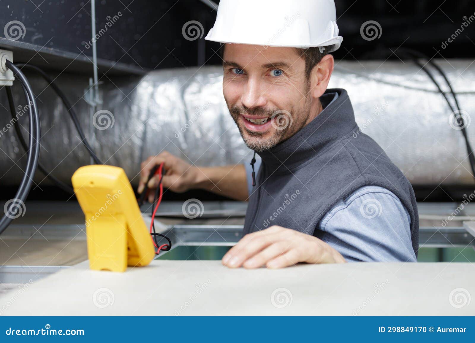 Male Electrician Testing Roof Electronics with Multimeter Stock Photo ...