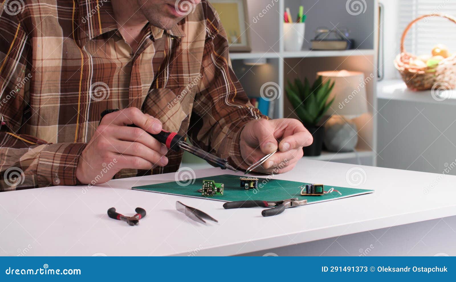 Male Electrician Using Soldering Tools Solders an Electrical ...