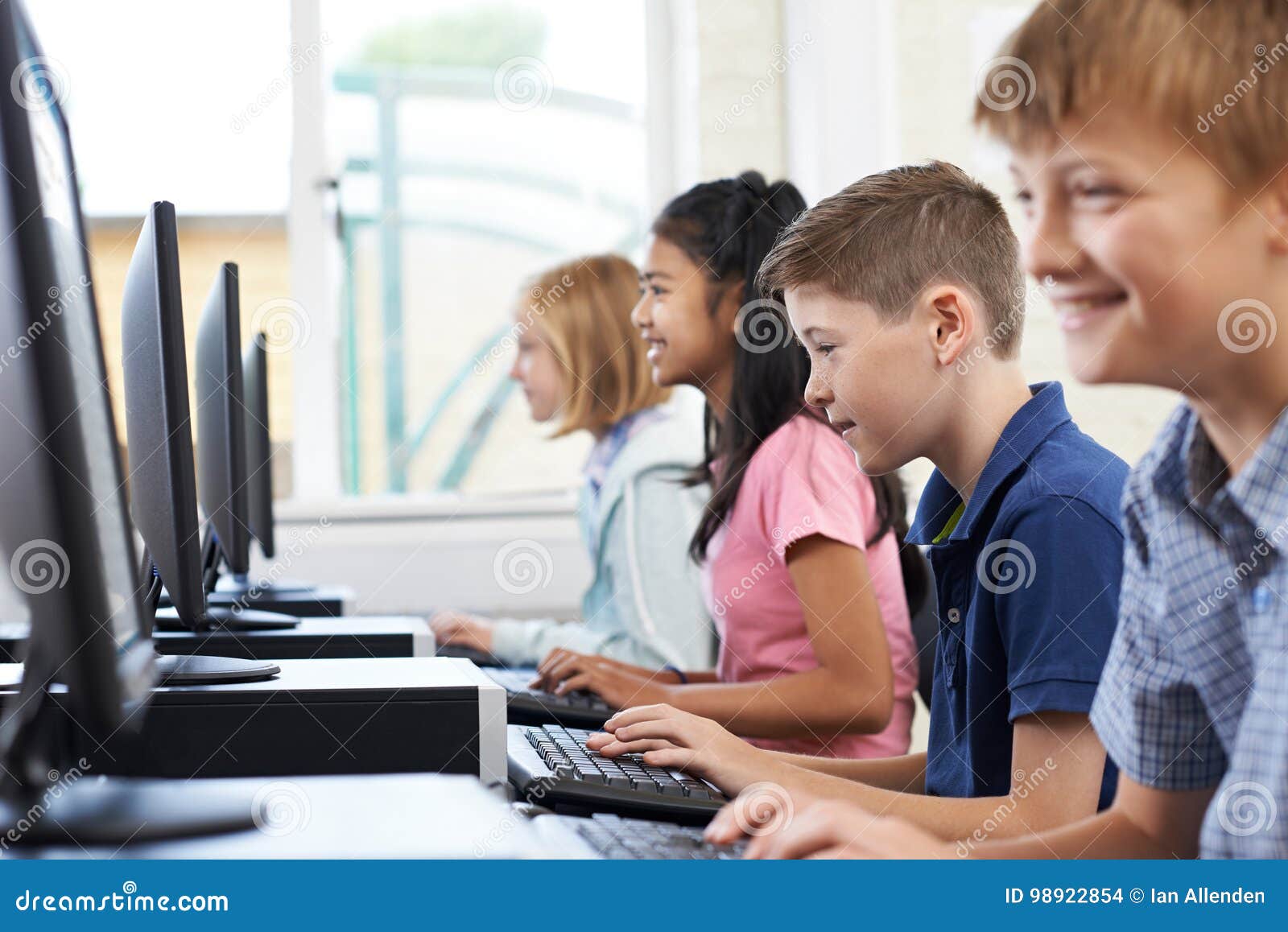 Line of Elementary Pupils in Computer Class Stock Photo - Image of ...
