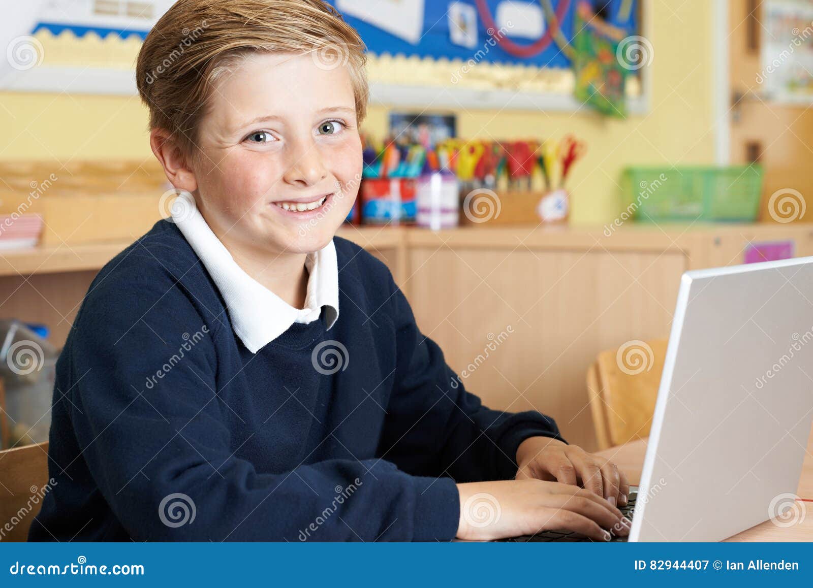 Male Elementary School Pupil Using Laptop in Computer Class Stock Image ...