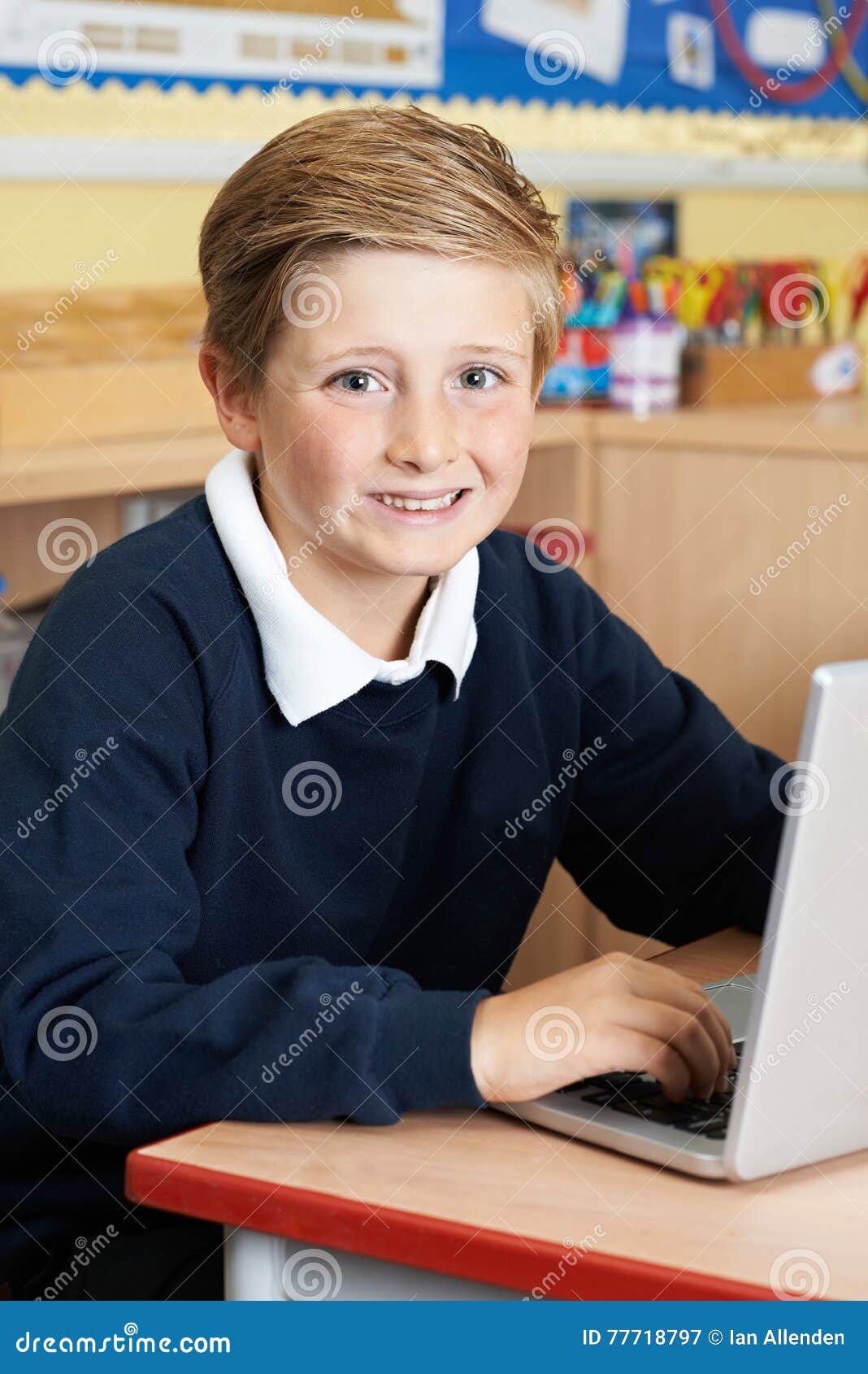 Male Elementary School Pupil Using Laptop in Computer Class Stock Image ...