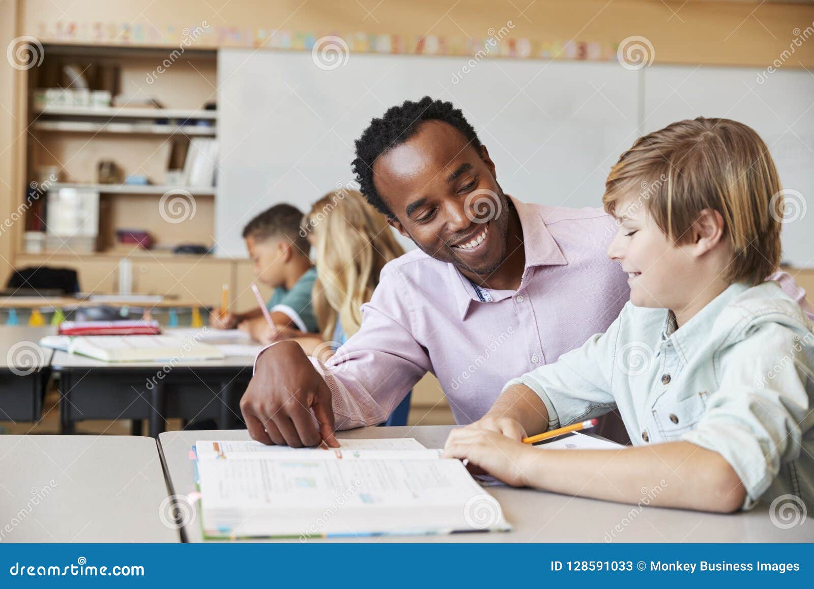Male Elementary School Teacher and Boy in Class, Close Up Stock Image ...