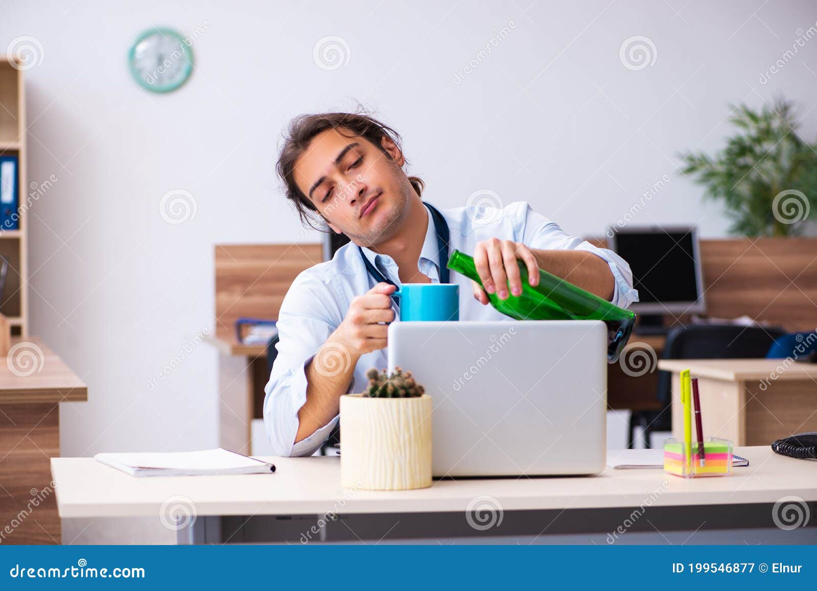 Young Male Employee Drinking Alcohol at Workplace Stock Image - Image ...