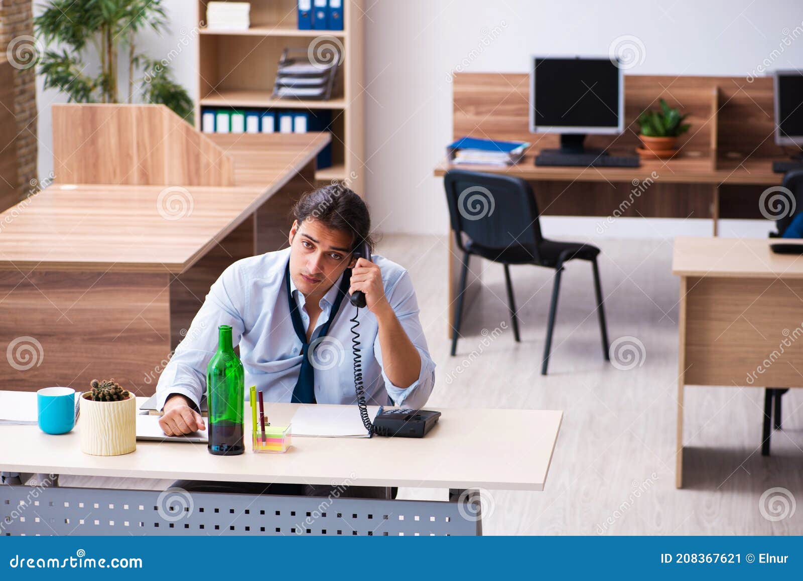Young Male Employee Drinking Alcohol at Workplace Stock Image - Image ...