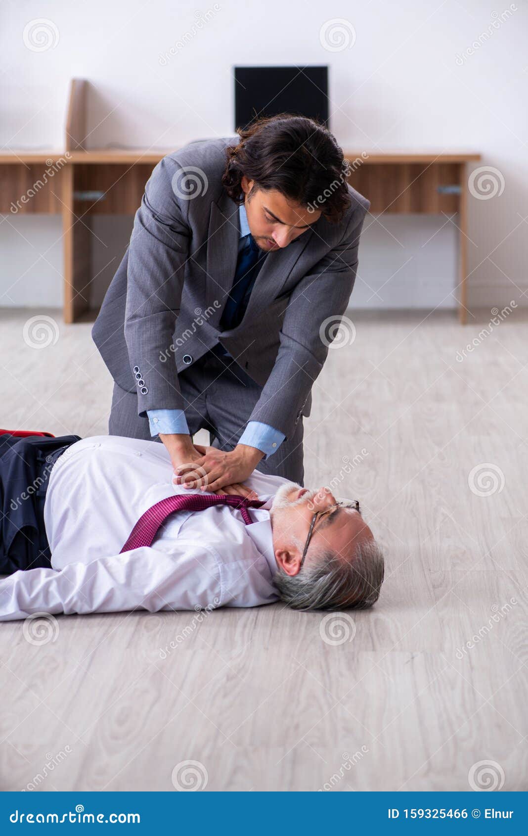 Male Employee Suffering from Heart Attack in the Office Stock Photo ...