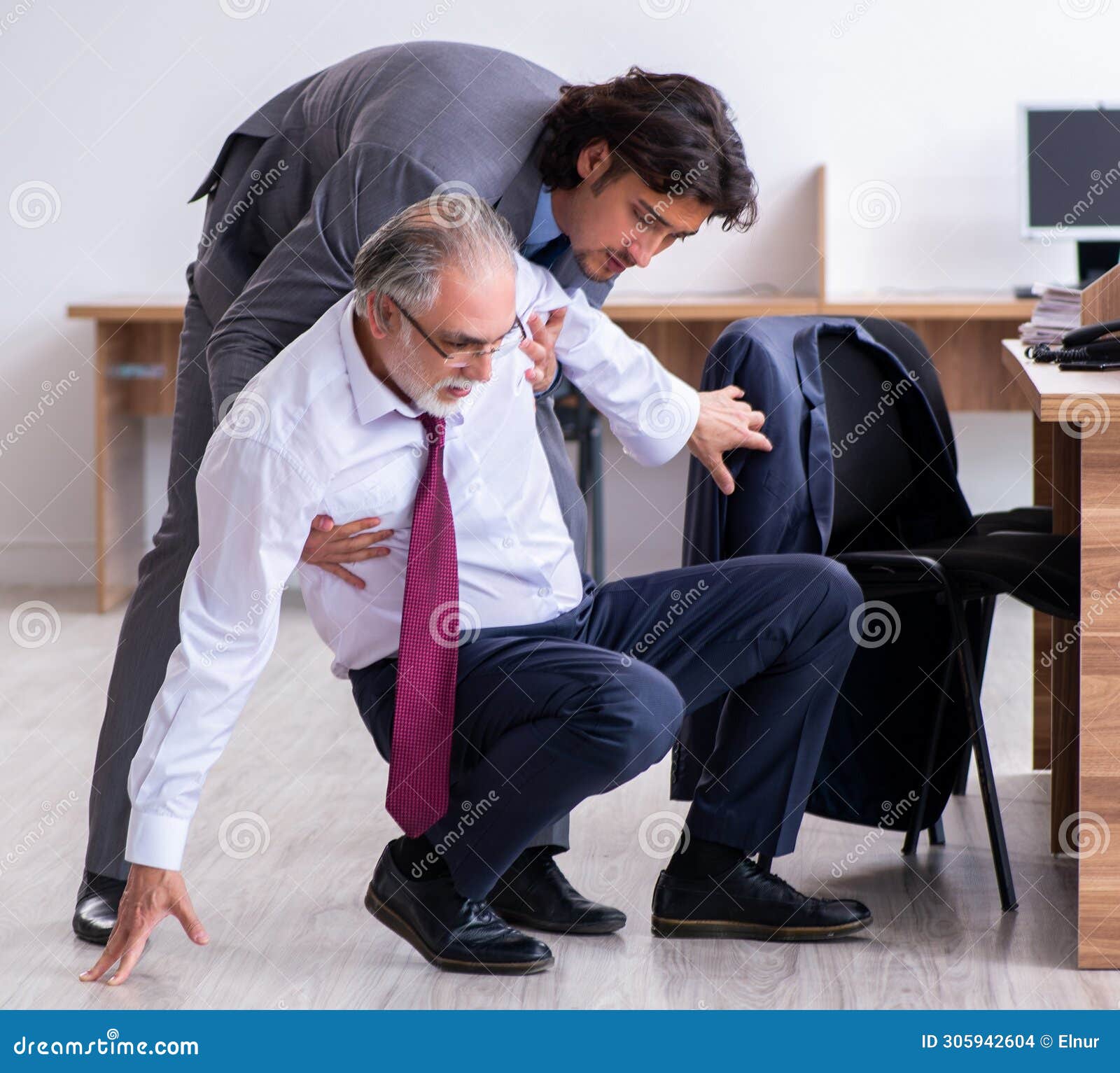 Male Employee Suffering from Heart Attack in the Office Stock Photo ...