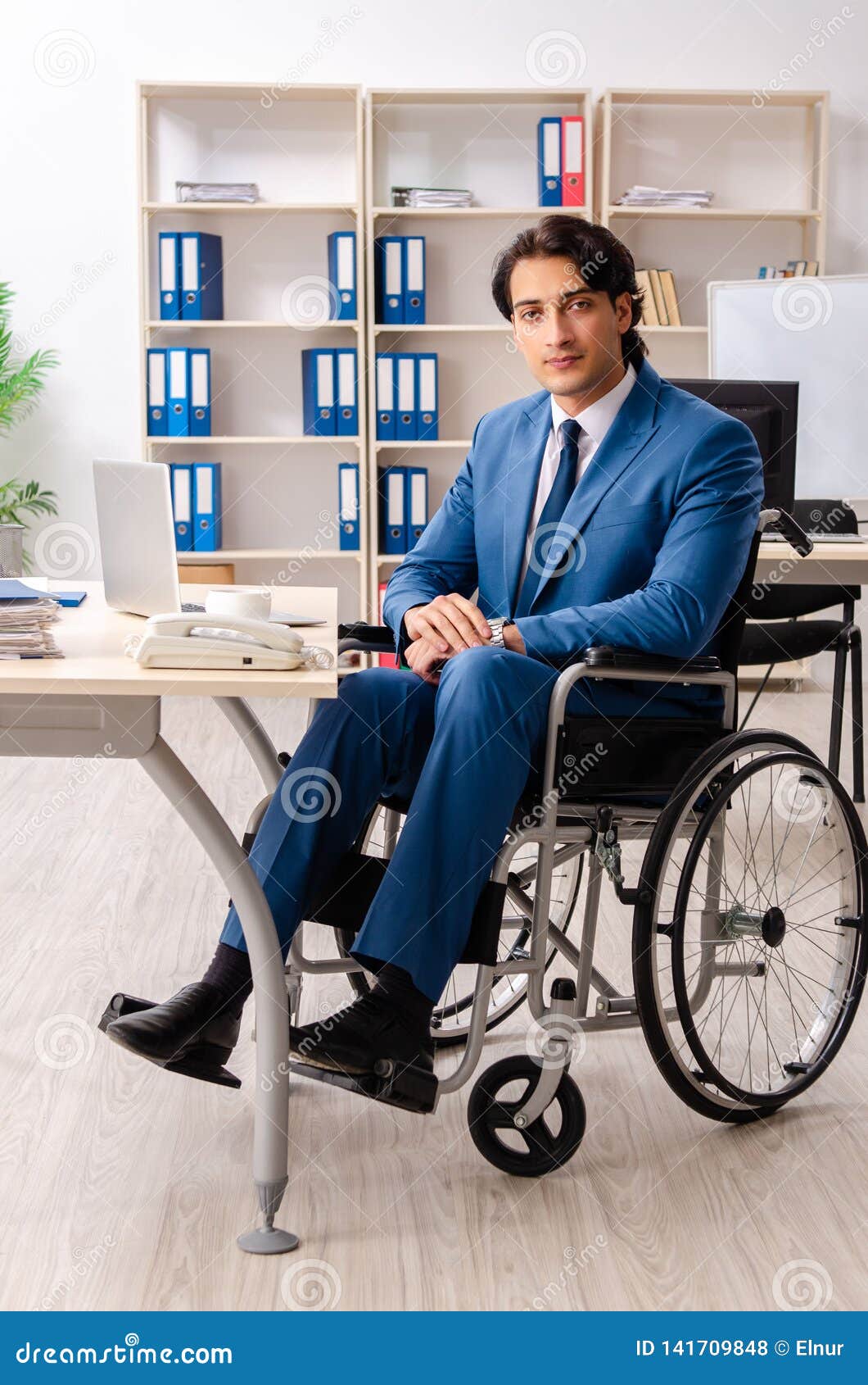 The Male Employee in Wheelchair Working at the Office Stock Photo ...