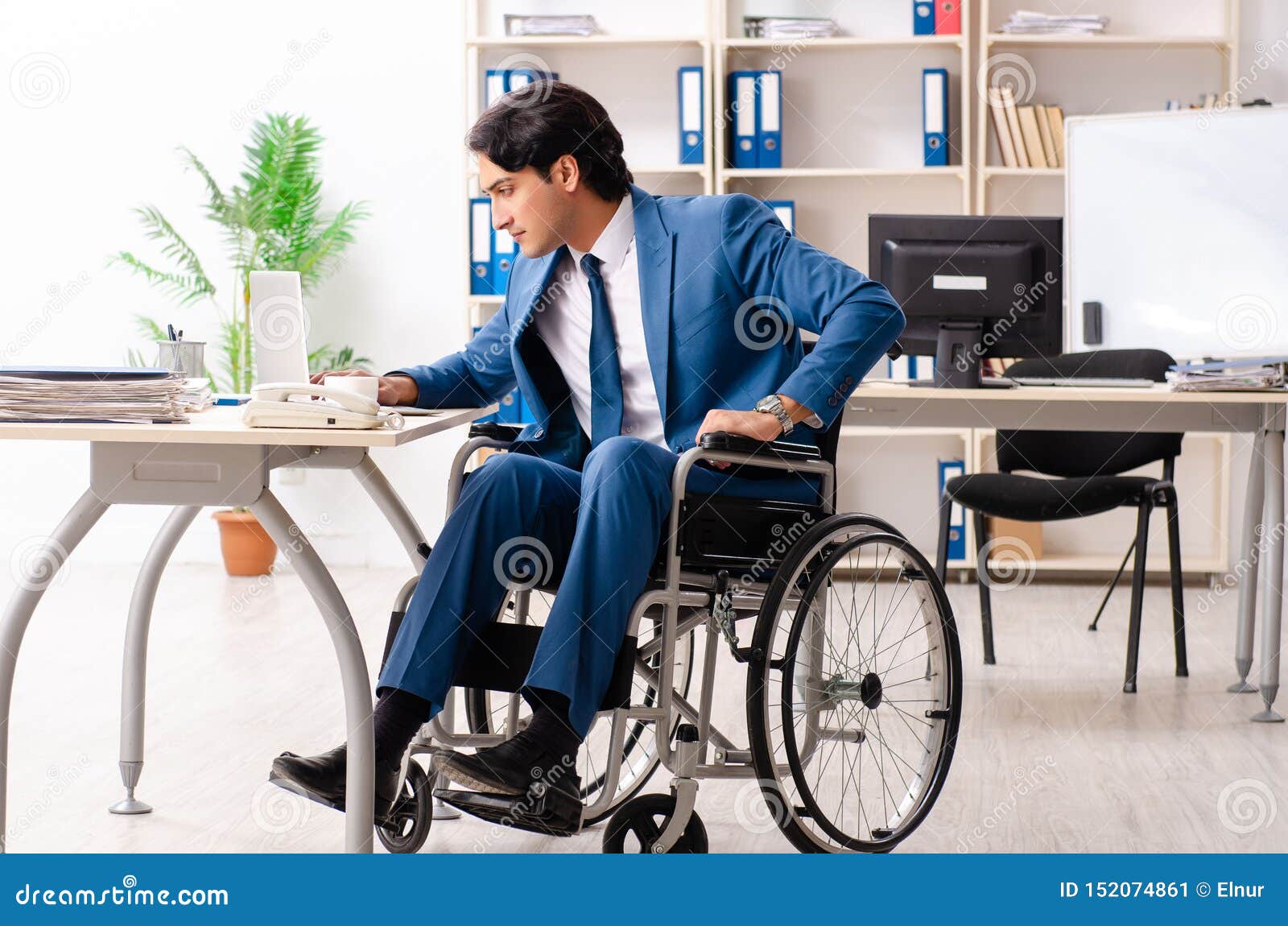 Male Employee in Wheelchair Working at the Office Stock Image - Image ...