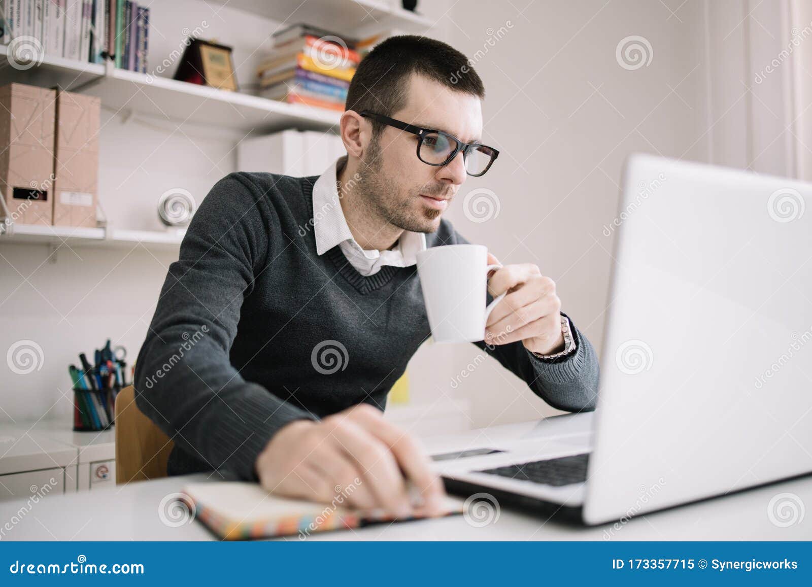 Male Employee Working on Computer and Drinking Coffee Stock Image ...