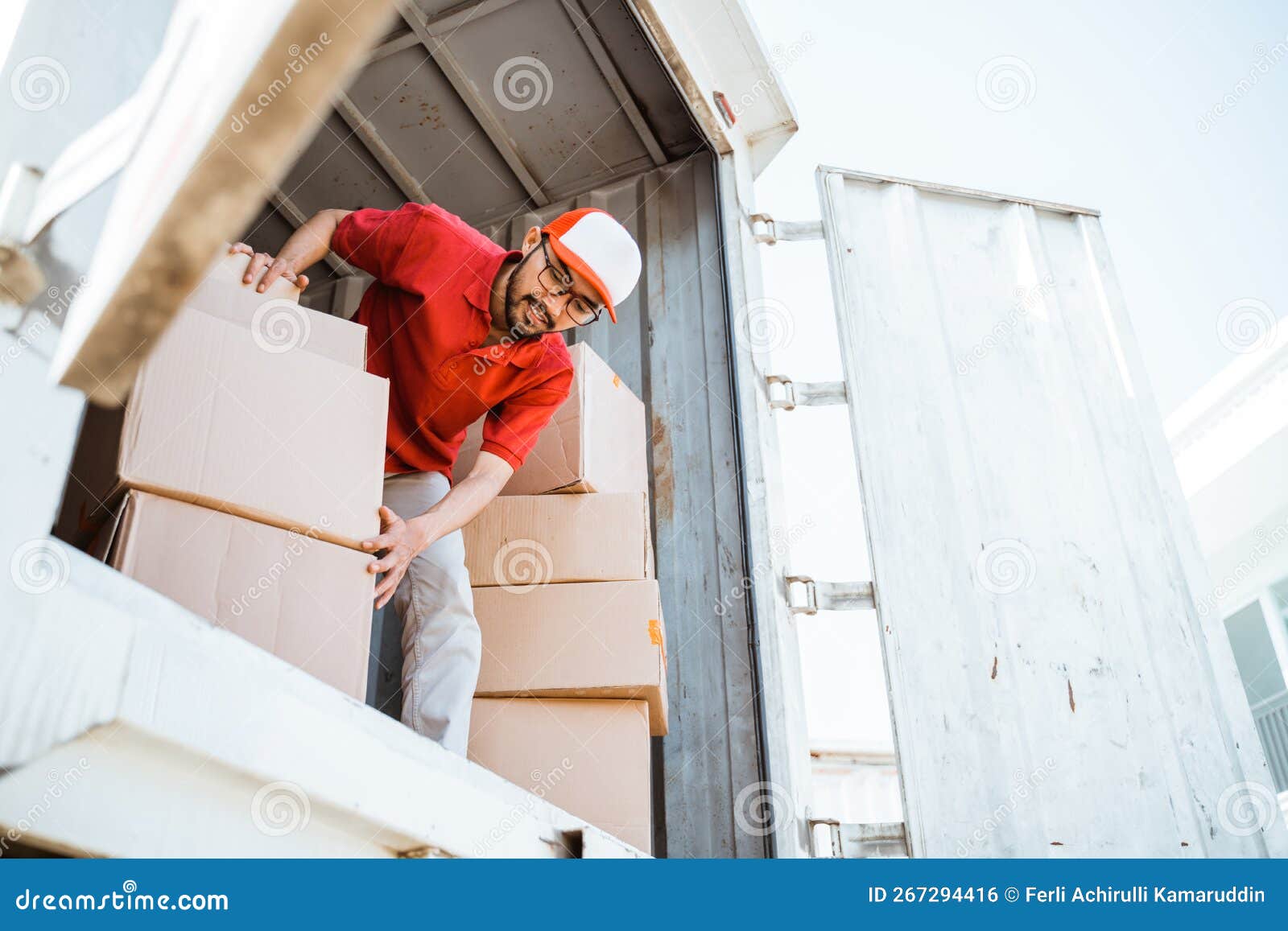 Male Employee Working Unloading Boxes from Containers Stock Photo ...