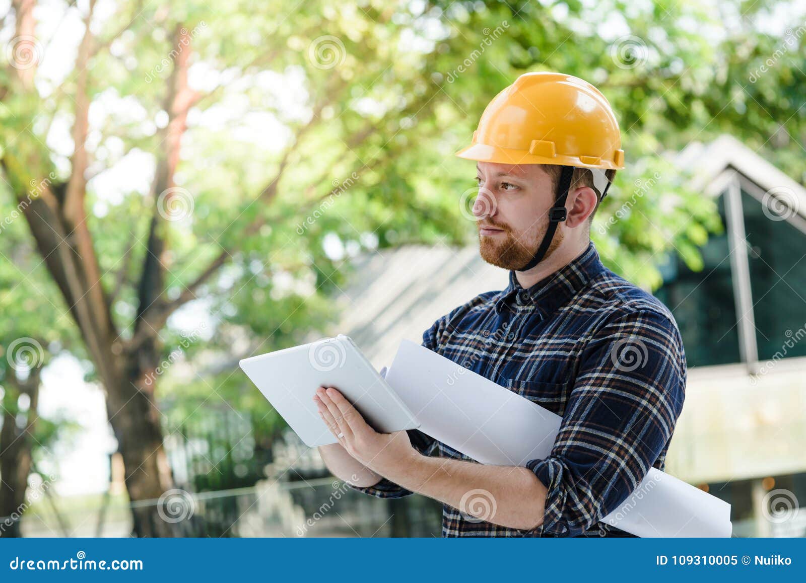 Male Engineer at a Construction Site with a Tablet Computer. Stock ...