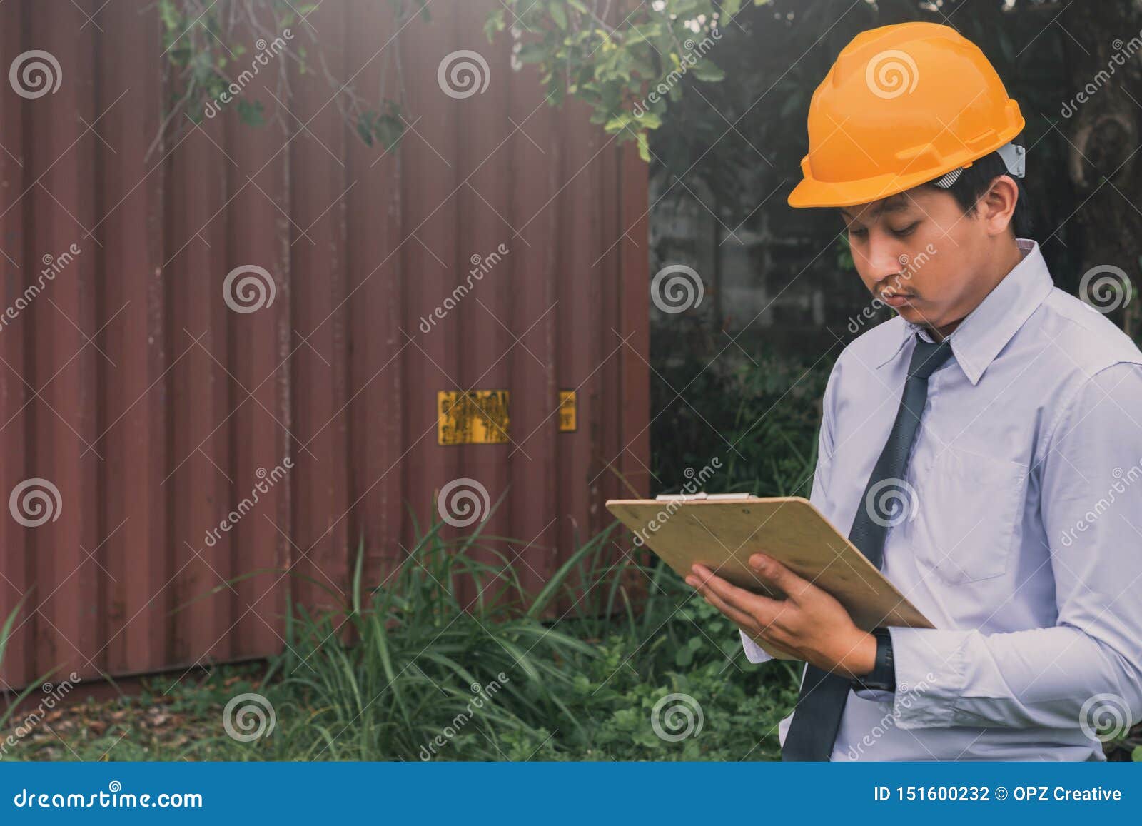 Male Engineer Inspection Checking on Container Background with Note on ...