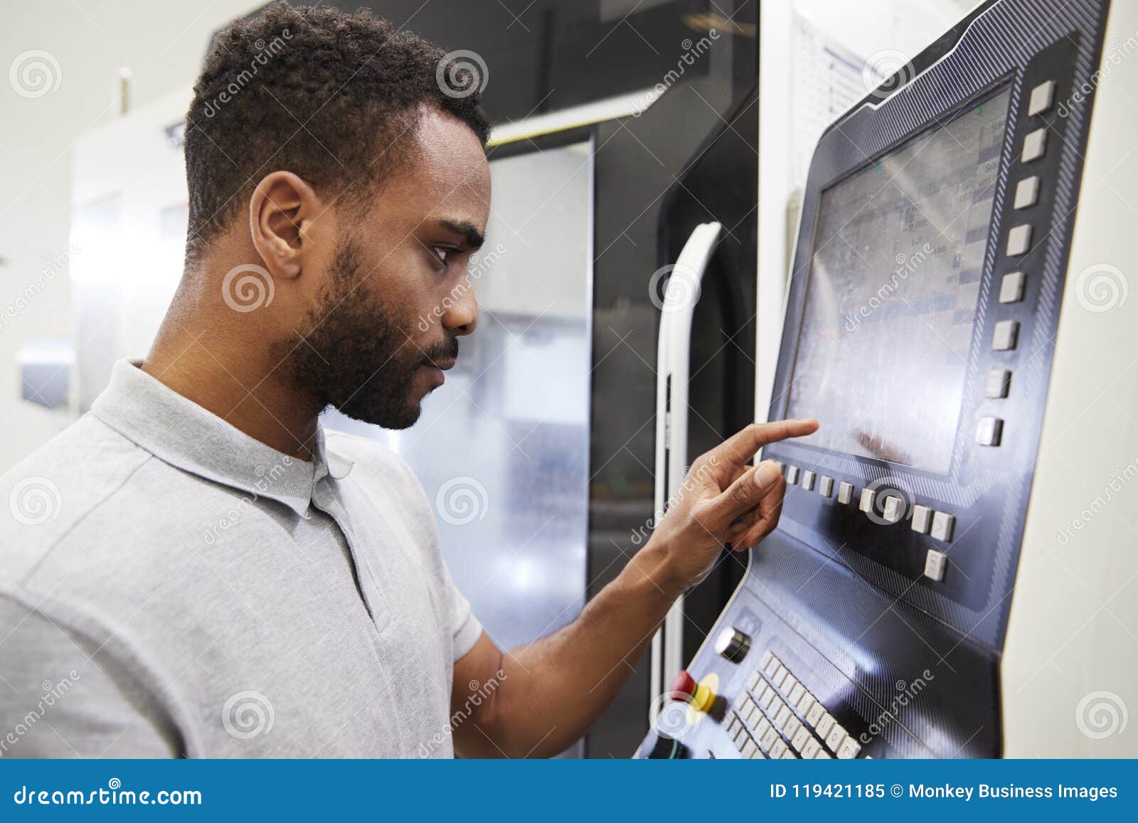 Male Engineer Operating CNC Machinery in Factory Stock Image - Image of ...