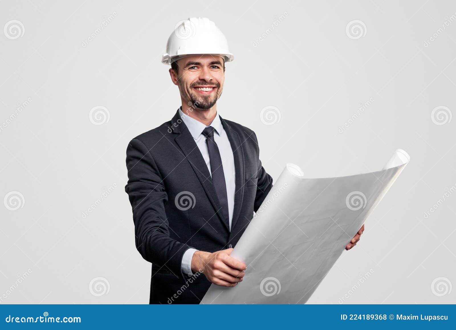 Male Engineer Reading Draft and Smiling Stock Photo - Image of employee ...