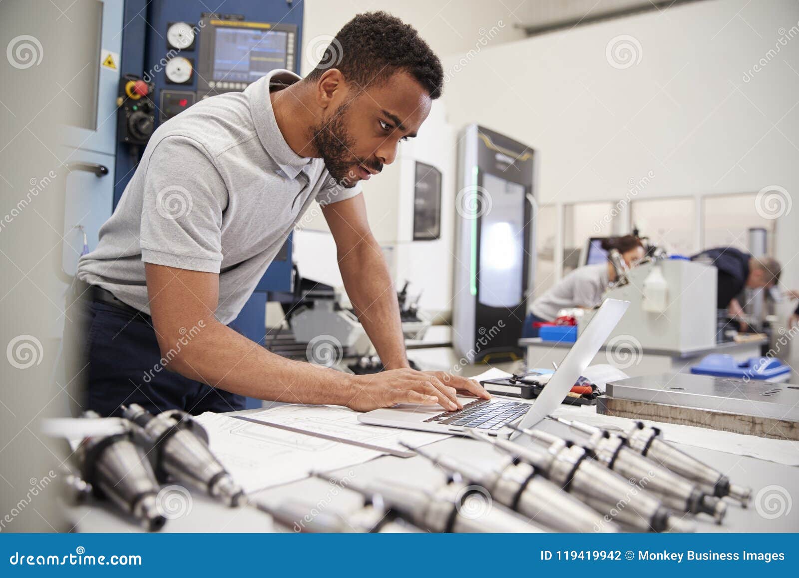 Male Engineer Using CAD Programming Software on Laptop Stock Photo ...