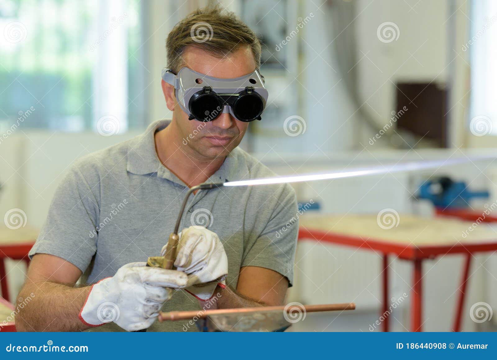 Male Engineer Using Gas Torch Wearing Protective Goggles Stock Photo ...