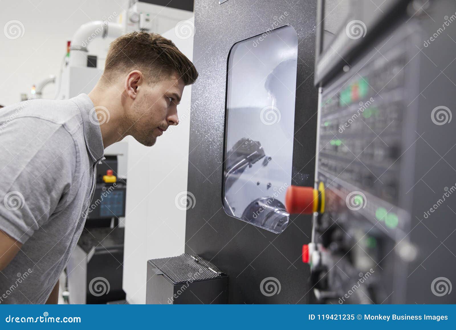 Male Engineer Watching Progress of CNC Machinery in Factory Stock Image ...