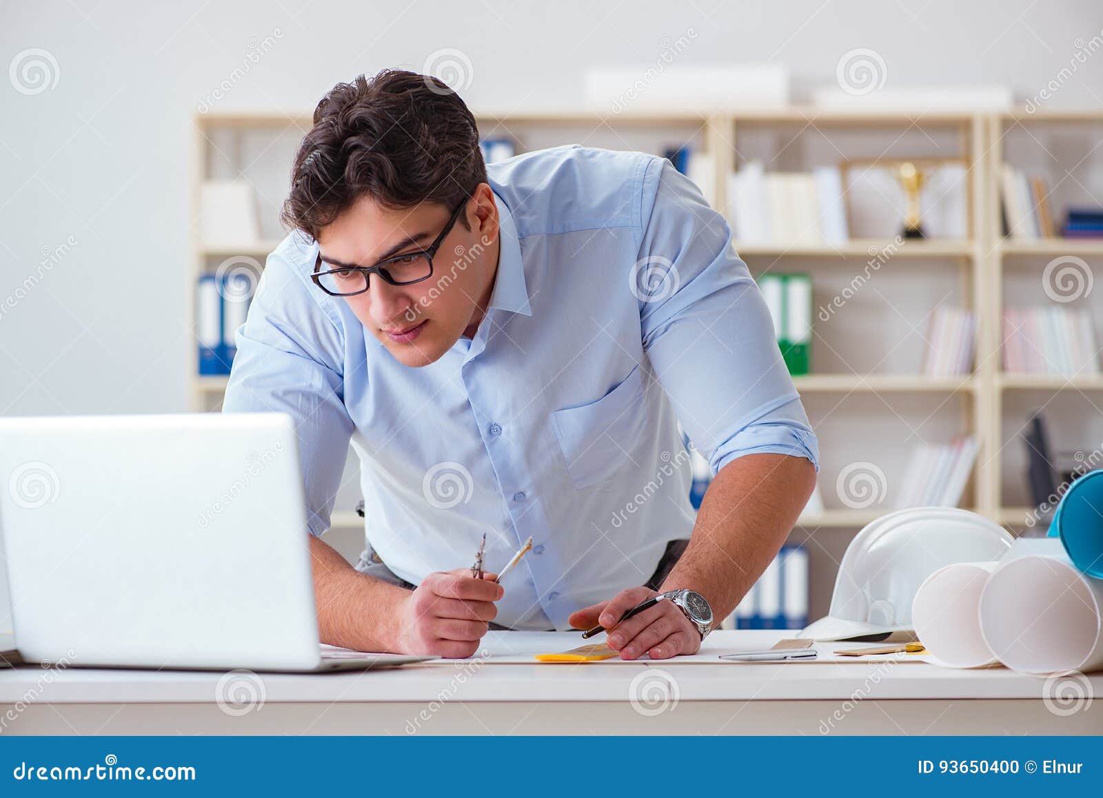 The Male Engineer Working on Drawings and Blueprints Stock Photo ...