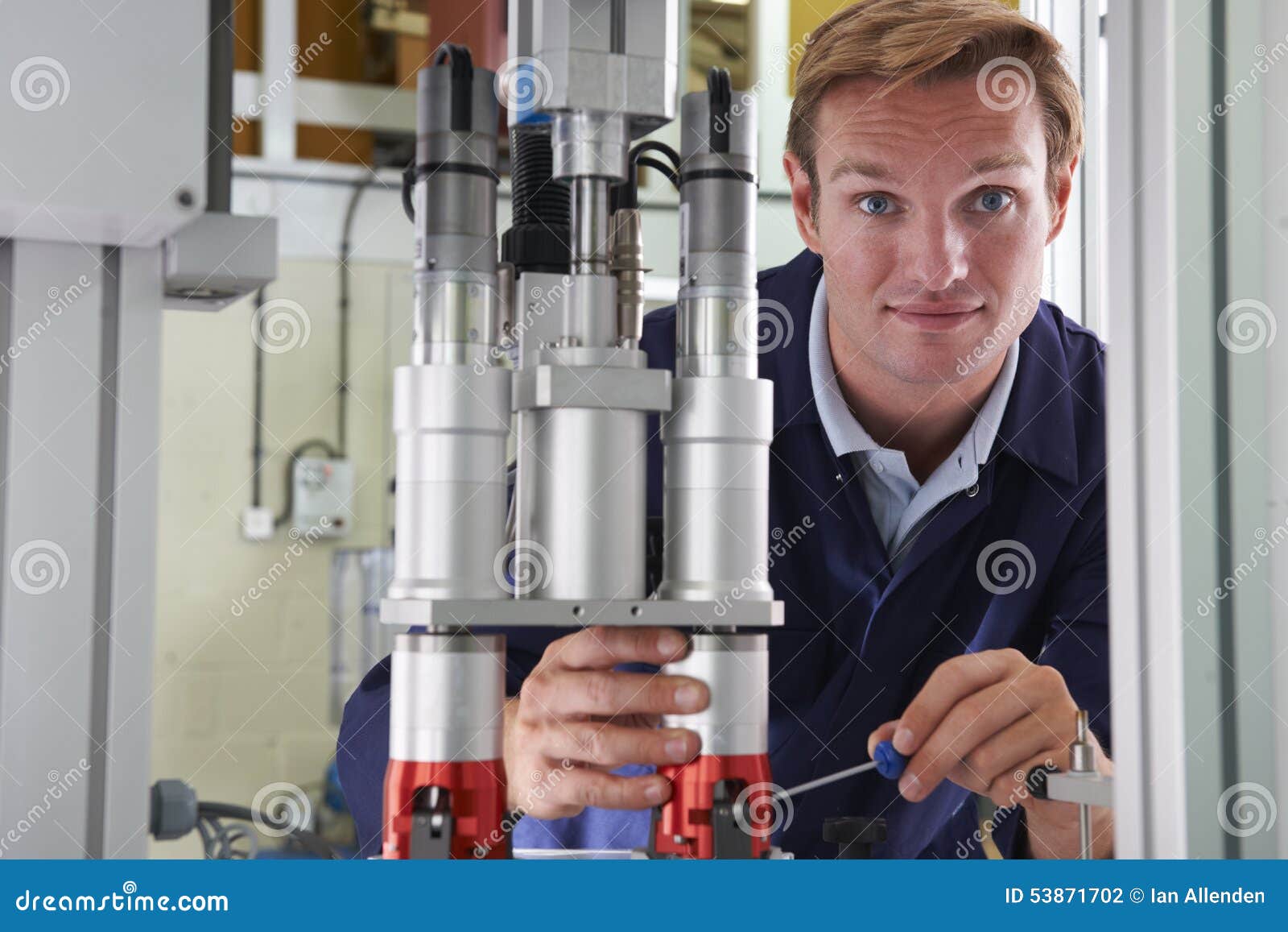 Male Engineer Working on Machine in Factory Stock Photo - Image of face ...