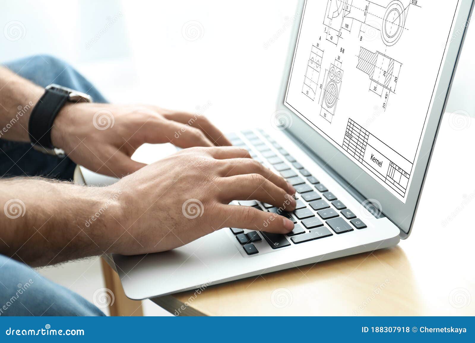 Male Engineer Working with Technical Drawing on Laptop at Table Stock ...
