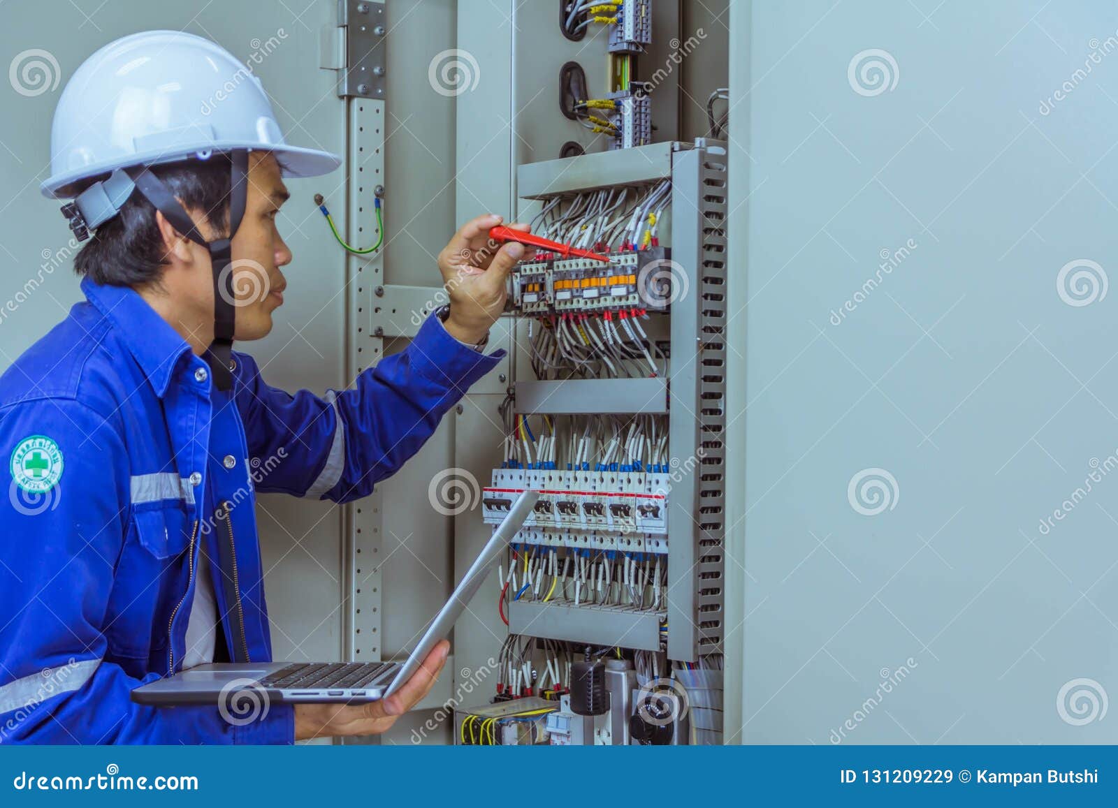 Male Engineers are Checking the Electrical System by Program in Stock ...