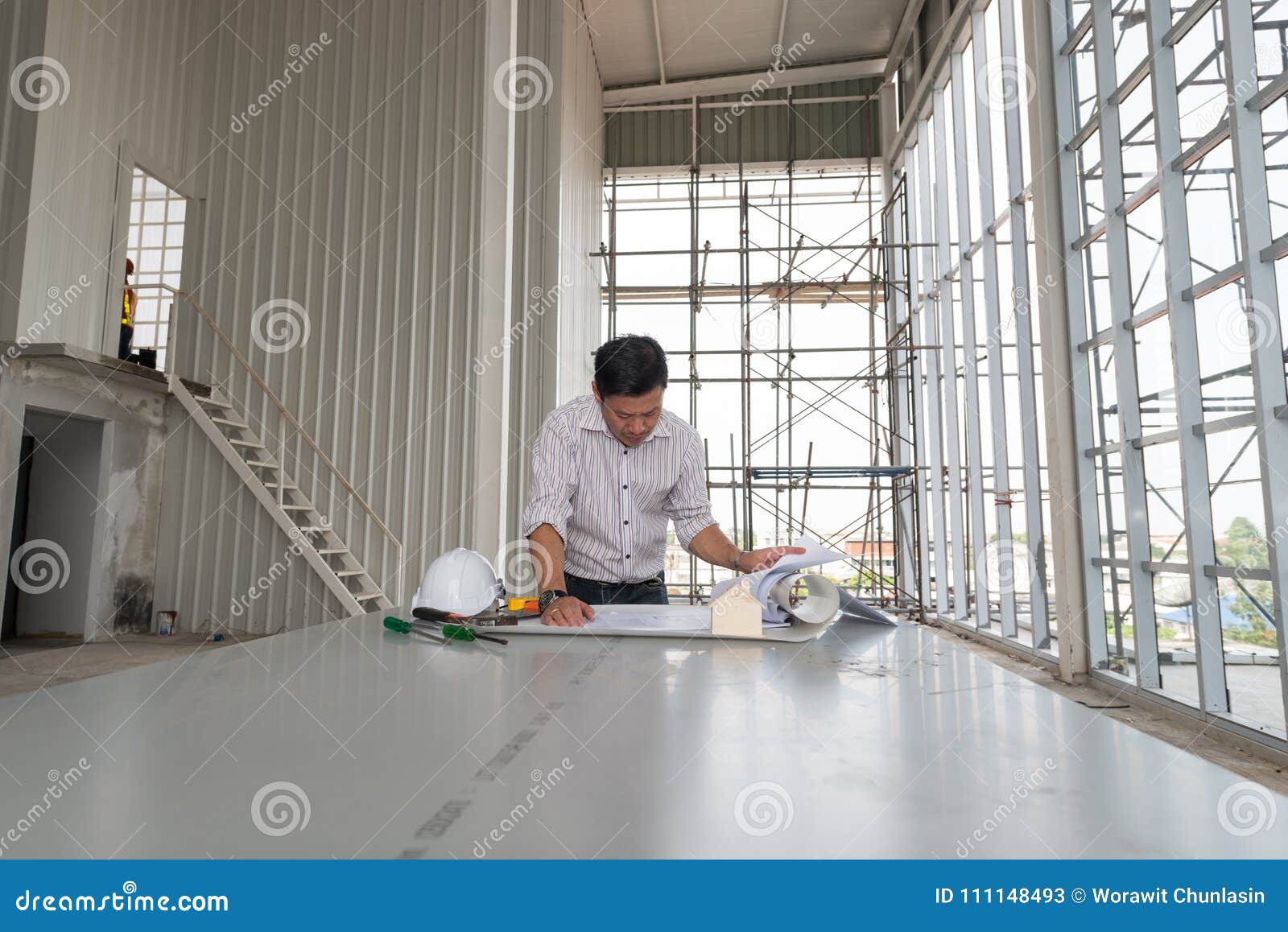 Male Engineers are Standing Watch Model in Building Construction Stock ...