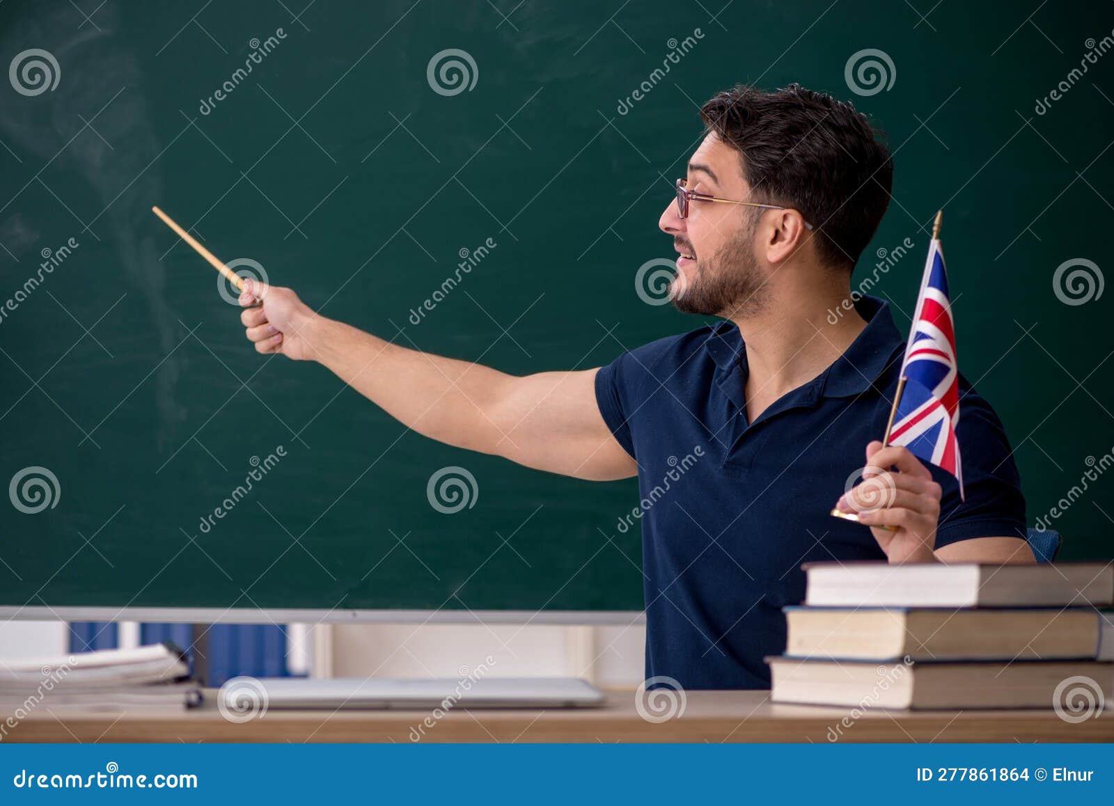 Male English Language Teacher in Front of Green Board Stock Photo ...