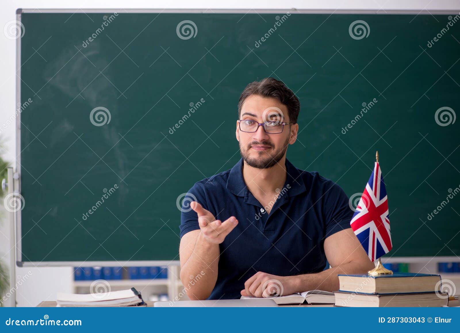 Male English Language Teacher in Front of Green Board Stock Image ...