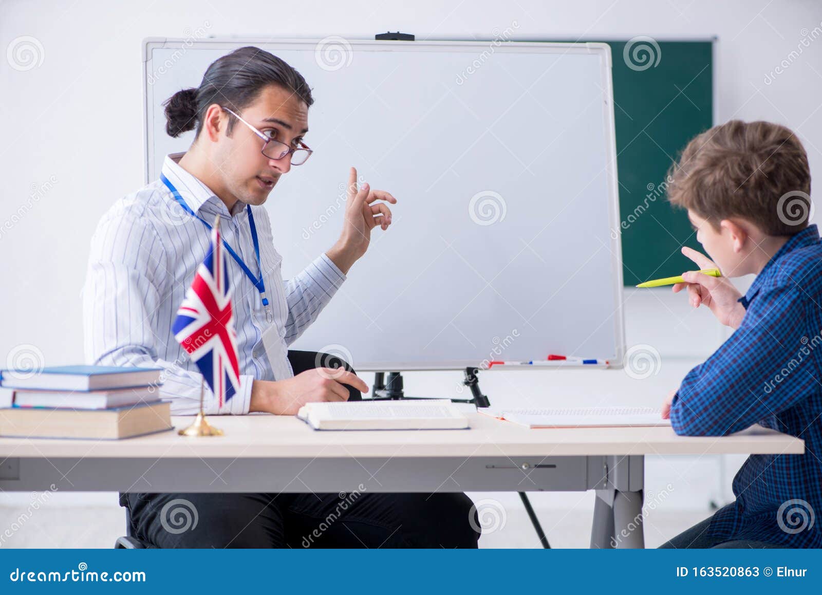 Male English Teacher and Boy in the Classroom Stock Image - Image of ...