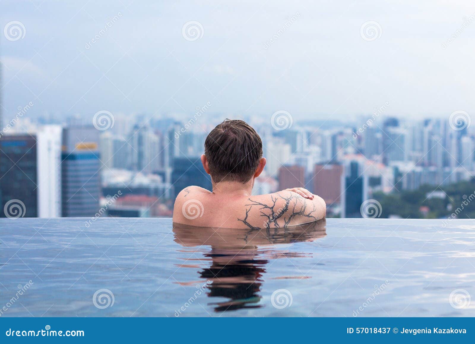 Male Enjoying the View from Infinity Pool Stock Image - Image of asia ...