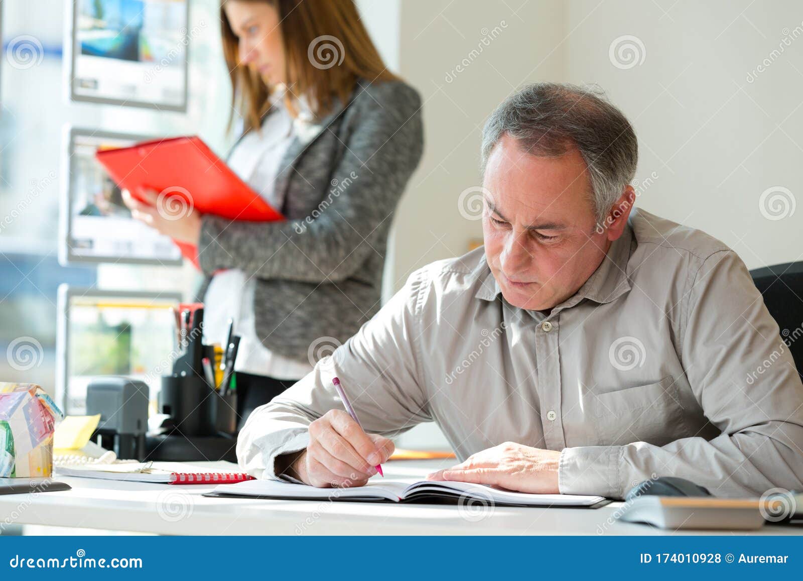 Male Estate Agent Working at Office Desk Stock Photo - Image of person ...