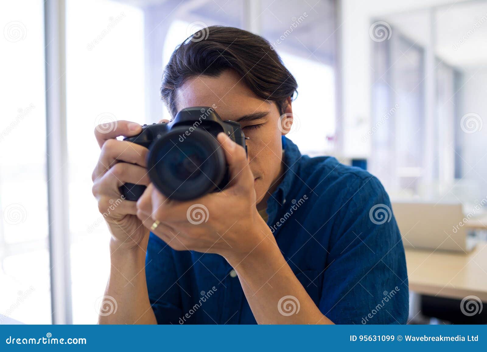 Male Executive Clicking a Picture on Digital Camera Stock Image - Image ...