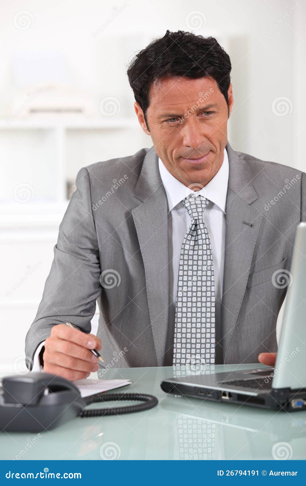 Male executive at laptop stock image. Image of 5054, businessman - 26794191