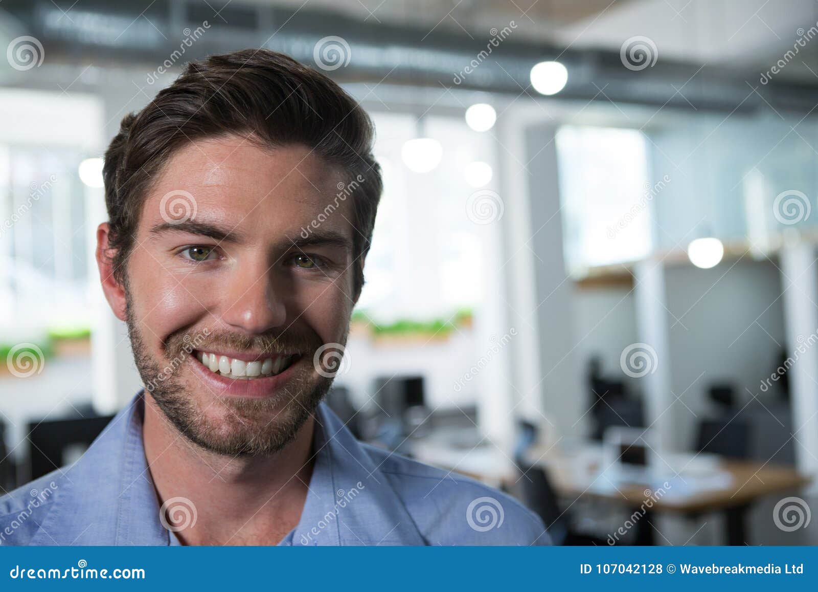Male Executive Looking at Camera in the Office Stock Photo - Image of ...