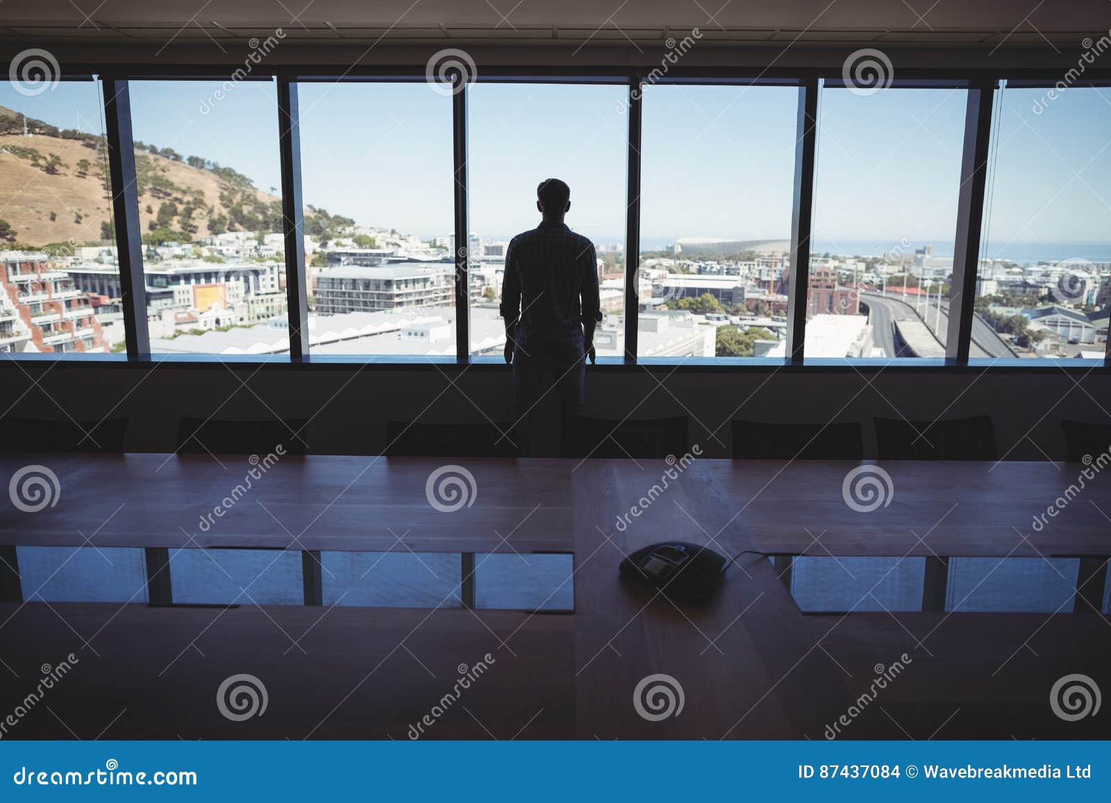 Male Executive Looking through Window Stock Photo - Image of confidence ...