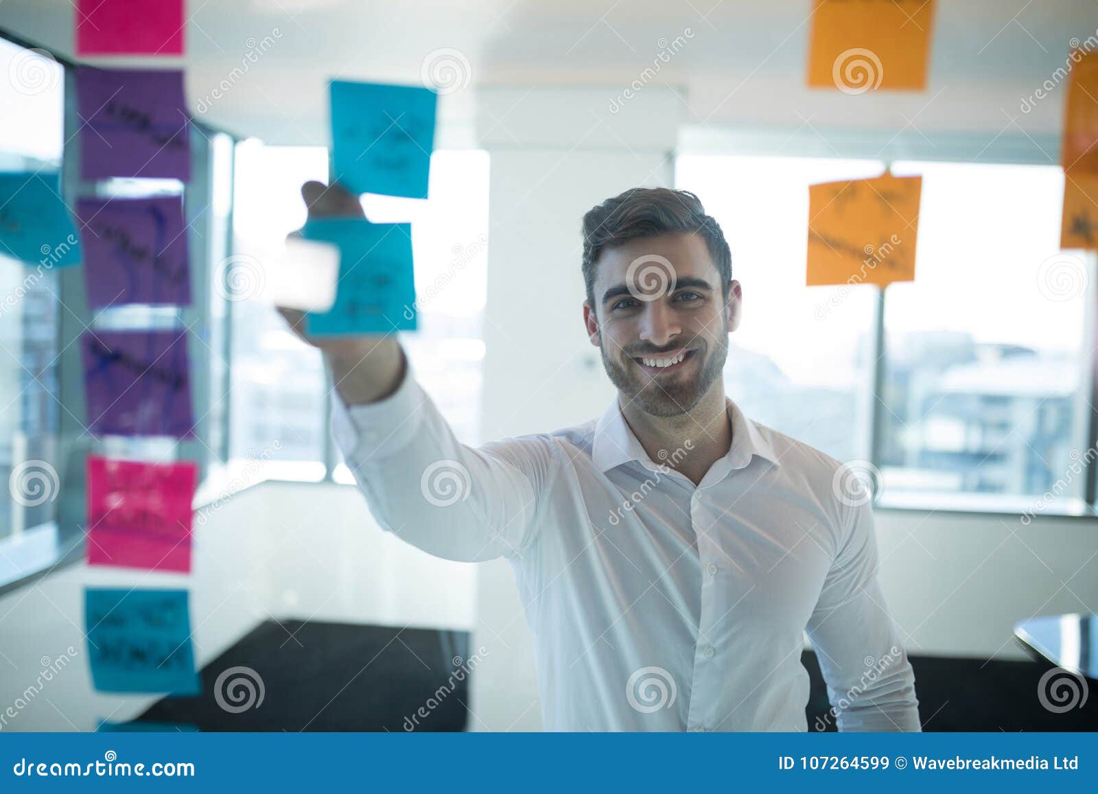Male Executive Reading Sticky Note Stock Image - Image of communication ...