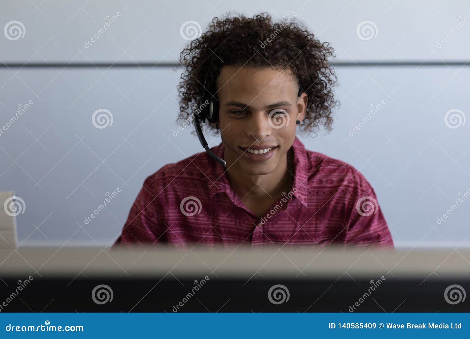 Male Executive Talking on Headset in Office Stock Image - Image of ...