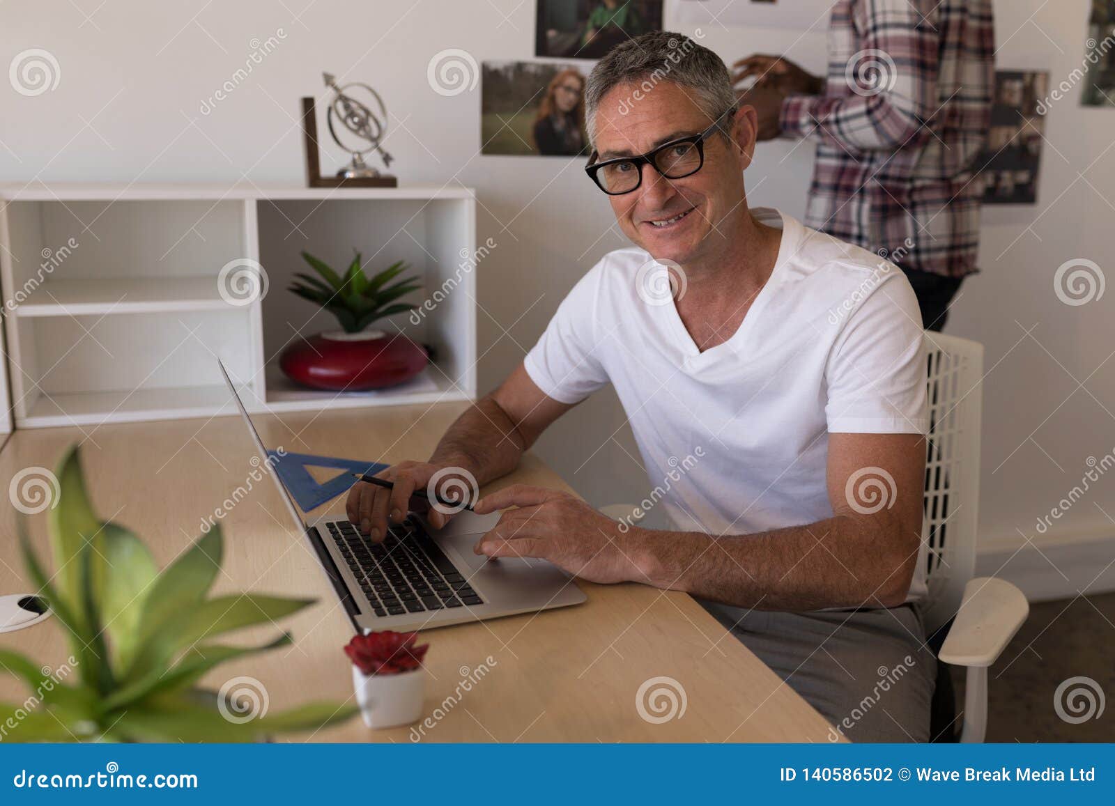 Male Executive Using Laptop in Office Stock Photo - Image of ...