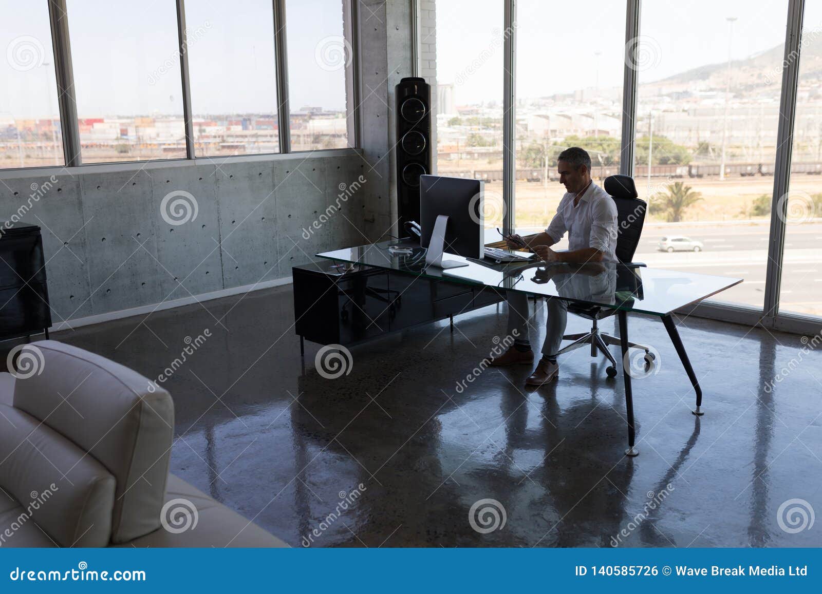 Male Executive Working at Desk in Office Stock Photo - Image of ...