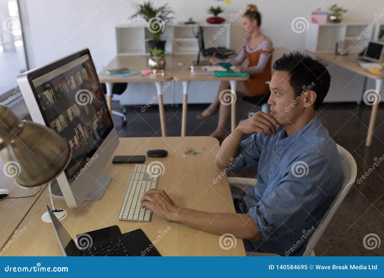 Male Executive Working on Personal Computer at Desk Stock Image - Image ...